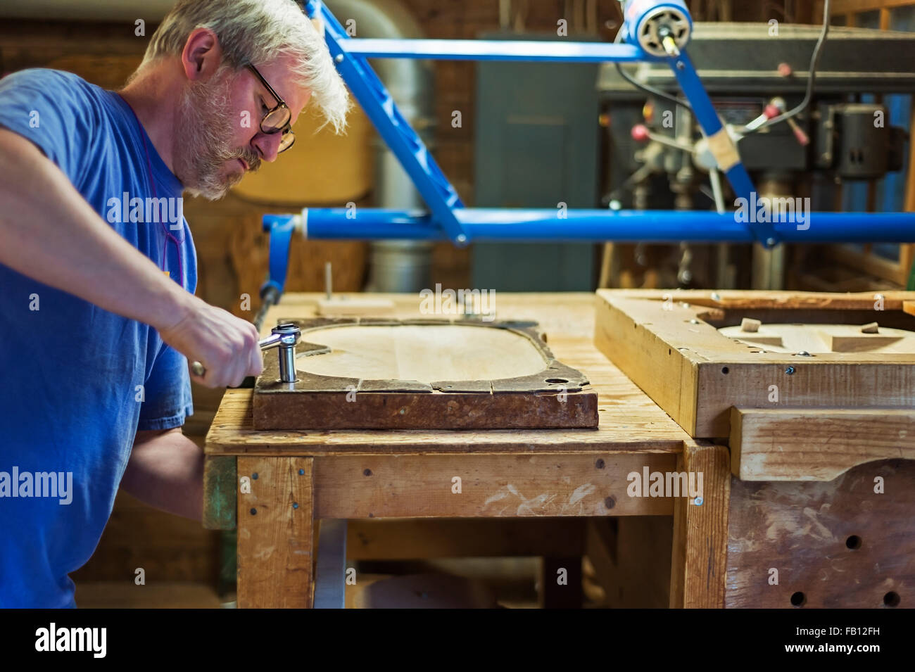 Carpenter working in workshop Stock Photo - Alamy