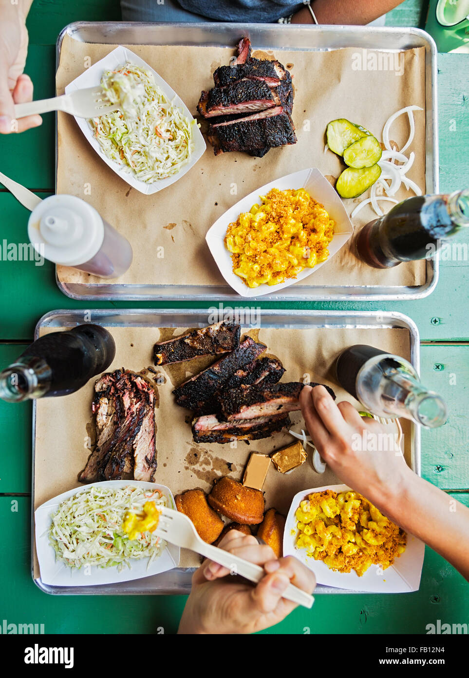 Friends eating barbecue food Stock Photo - Alamy