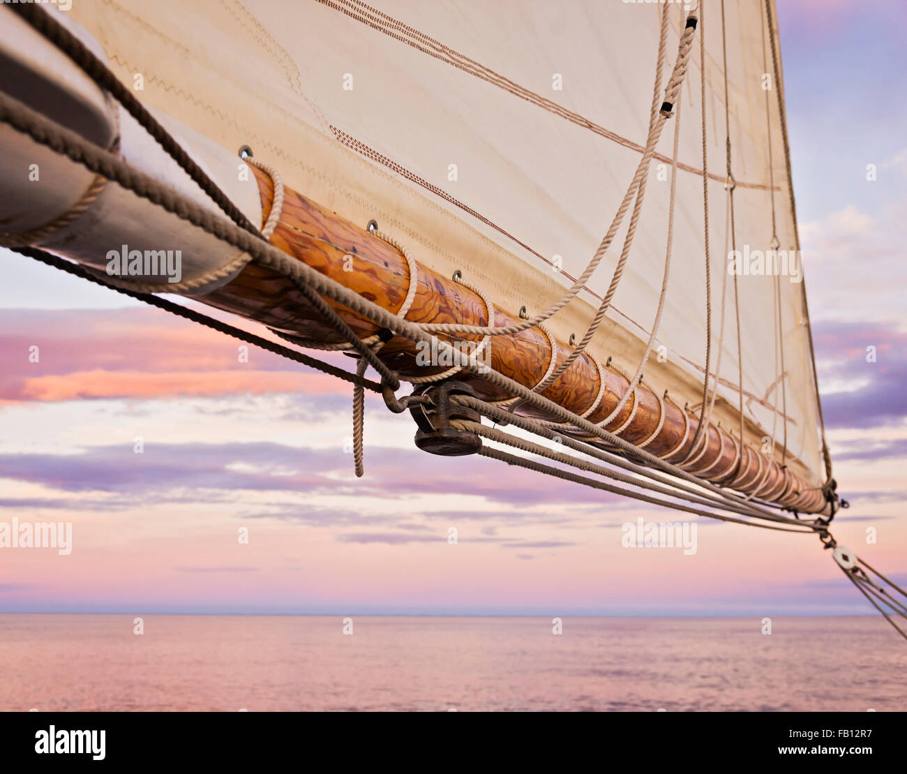 Close-up of sail and ropes against sunset sky Stock Photo - Alamy