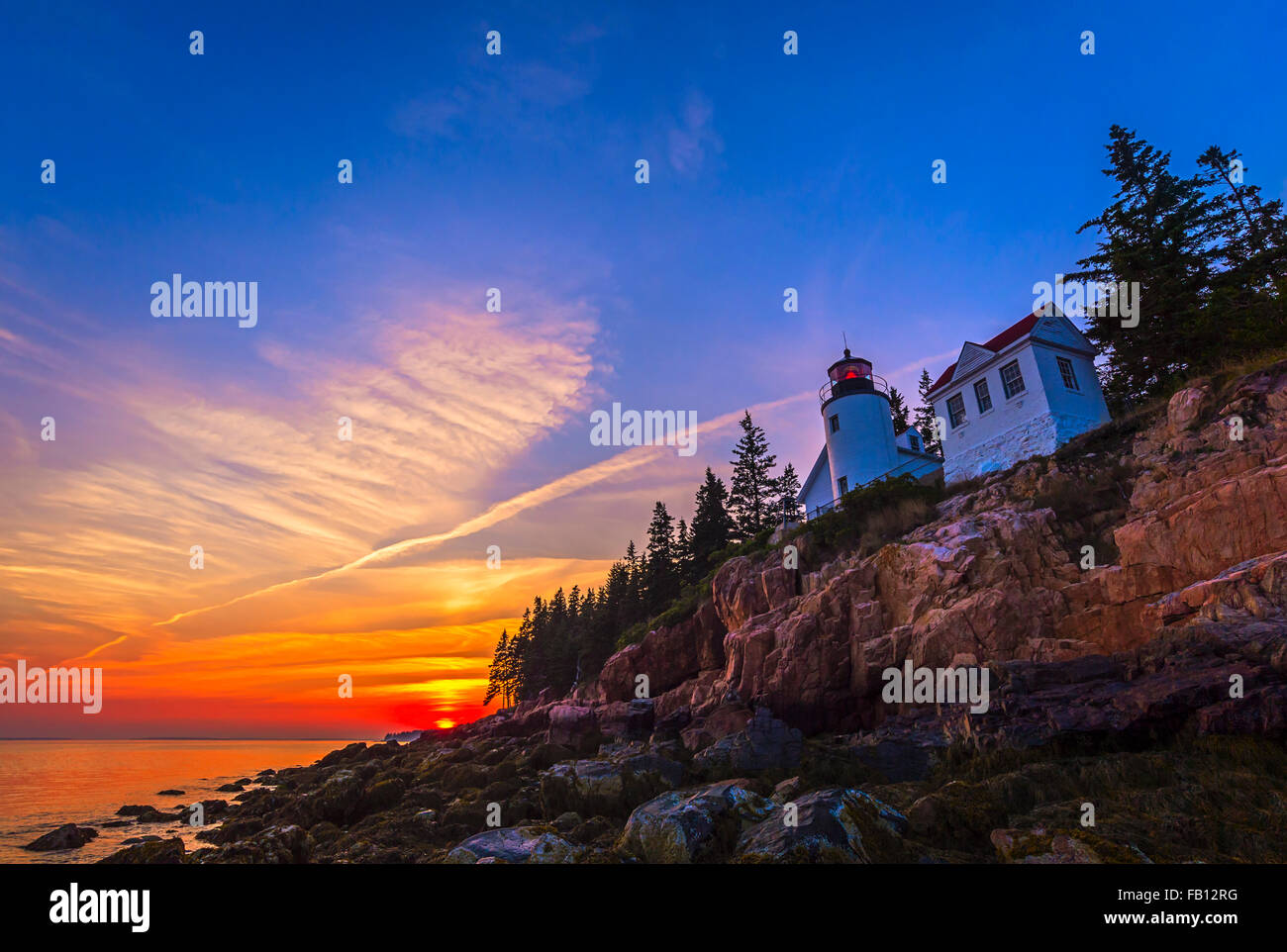 Lighthouse at sunset Stock Photo - Alamy