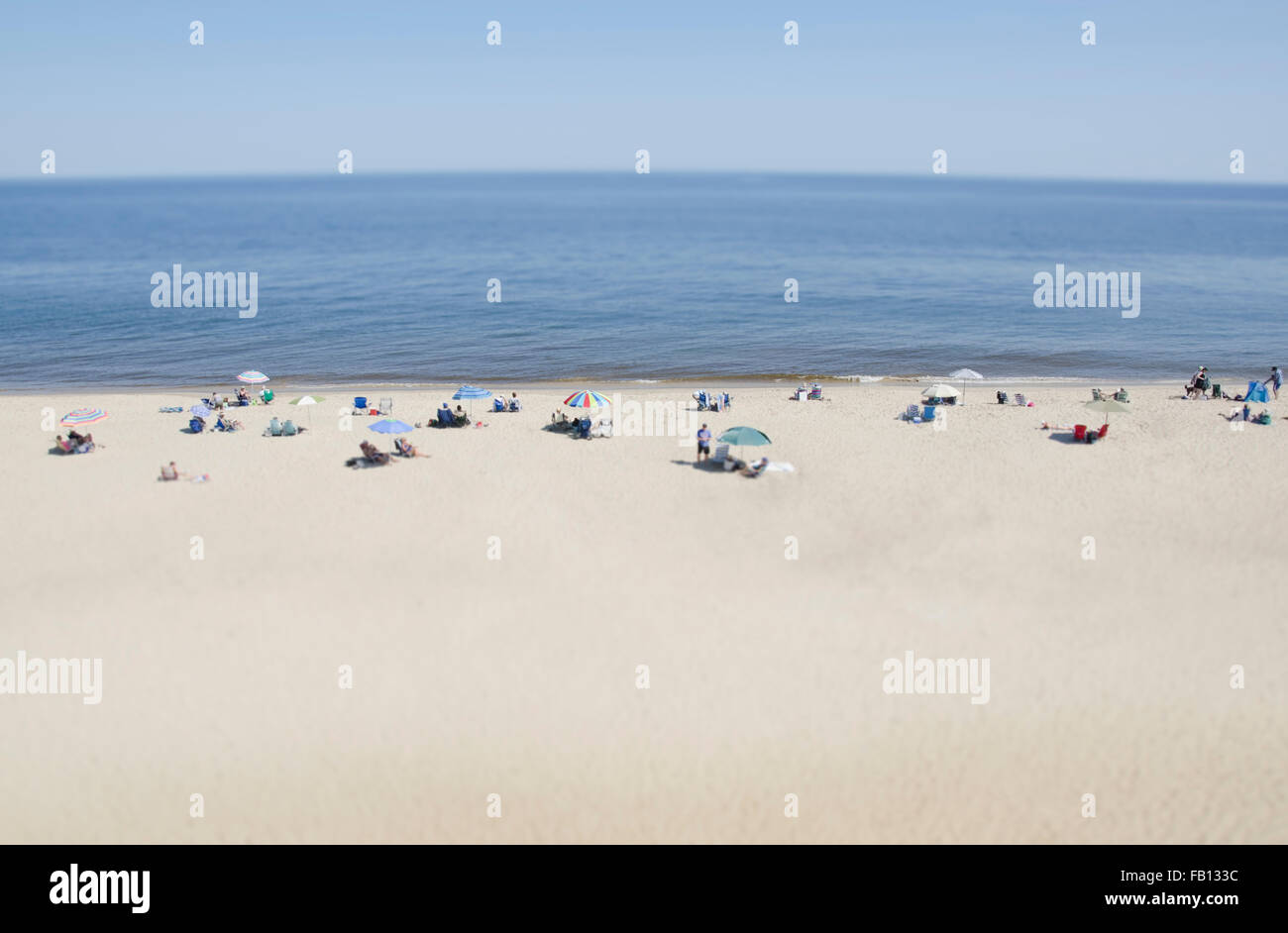 People relaxing on beach Stock Photo - Alamy