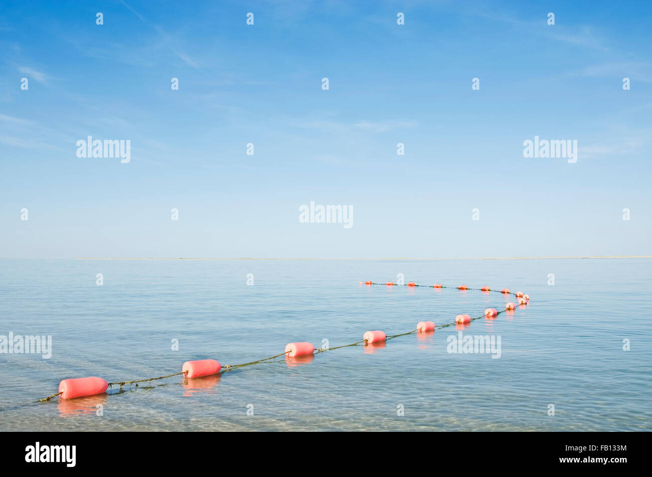 Rope with buoys on calm sea Stock Photo - Alamy