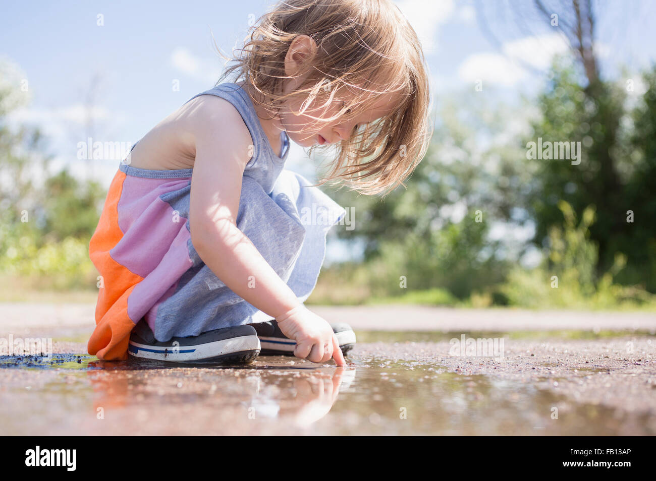 Girl in dress playing hi-res stock photography and images - Alamy