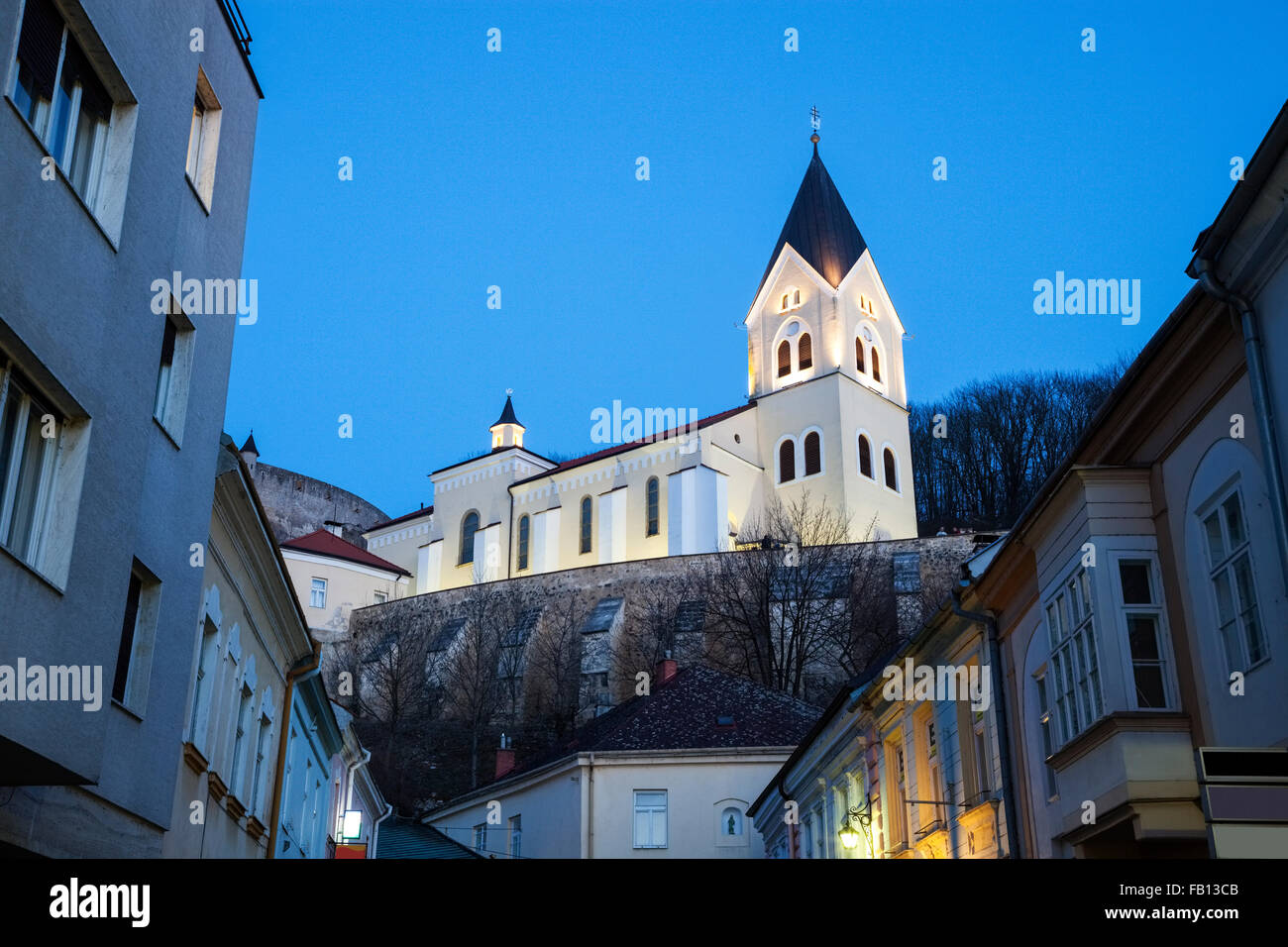 Illuminated church at dusk Stock Photo - Alamy