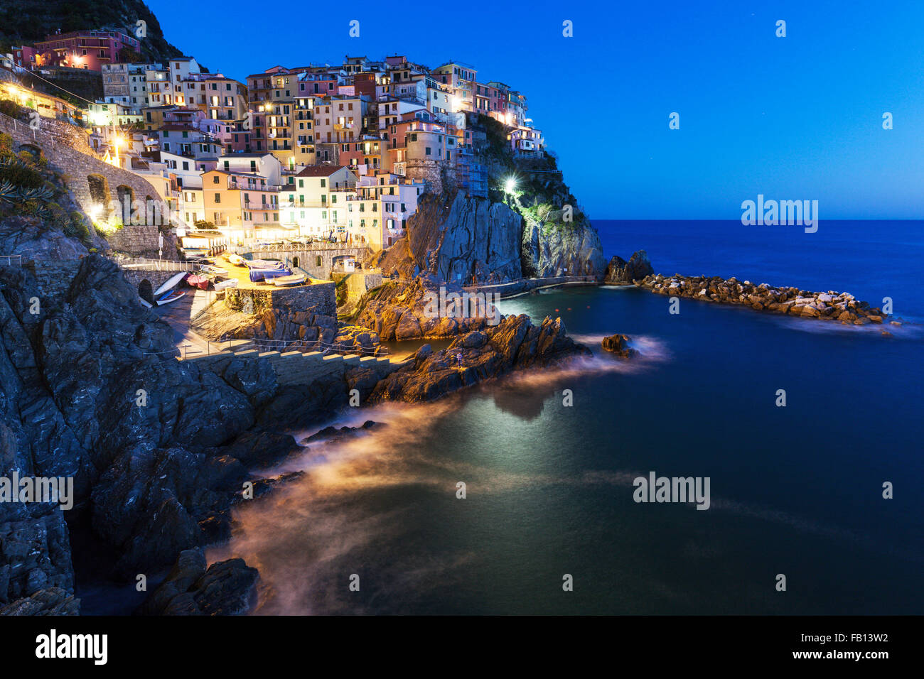 Coastal town at night Stock Photo - Alamy