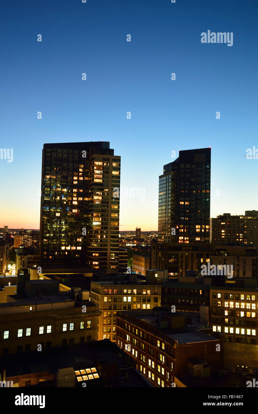 Dusk lights over cityscape Stock Photo - Alamy