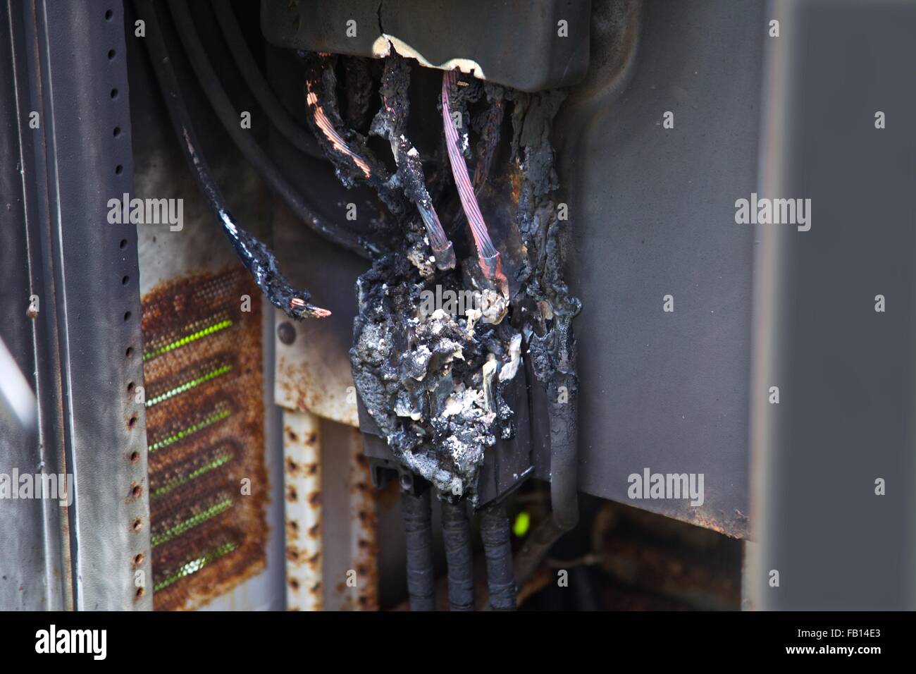 A burnt out 3 phase power box and cable, Thailand Stock Photo - Alamy