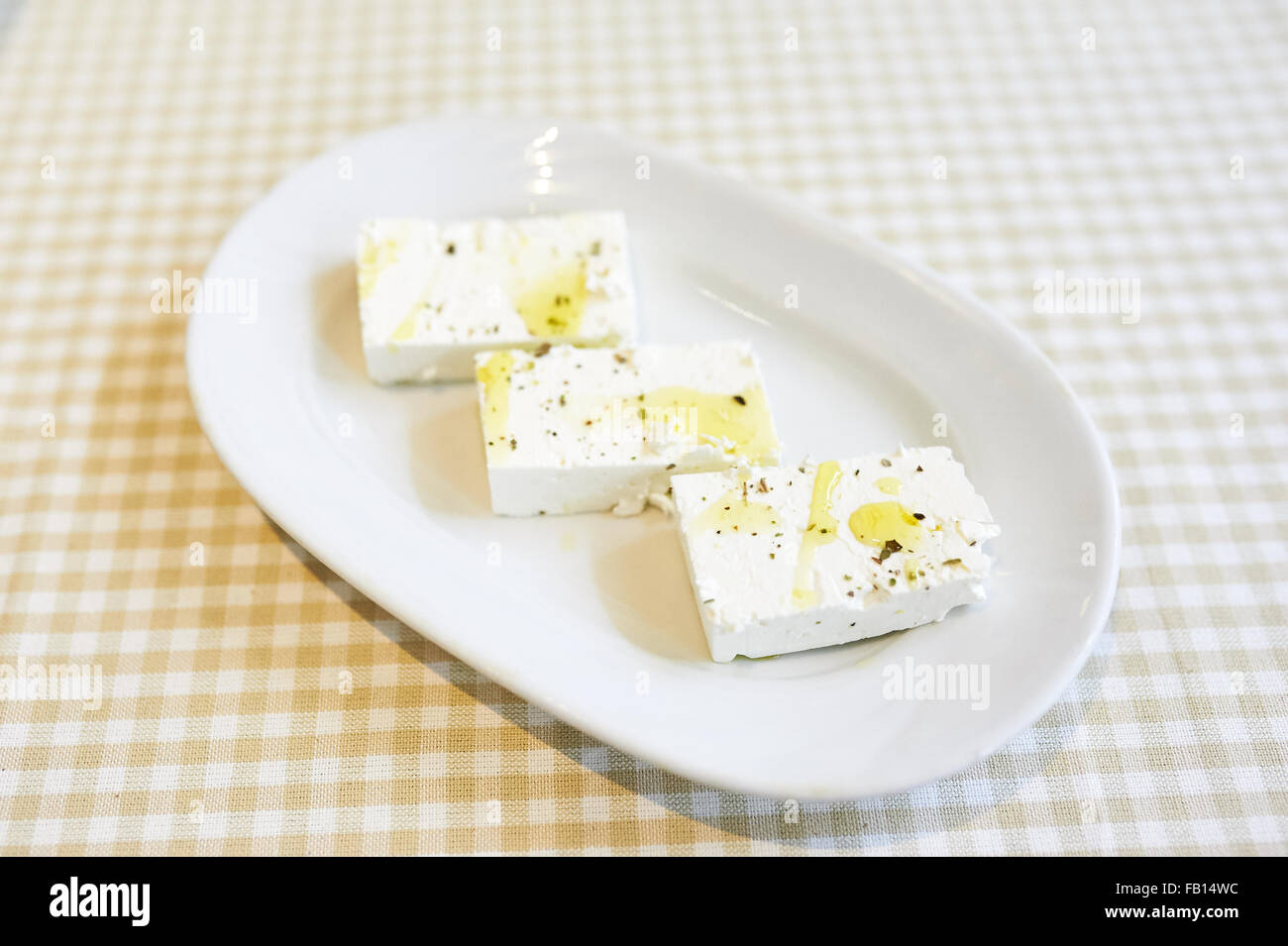 White Soft Cheese With Olive Oil Stock Photo - Alamy