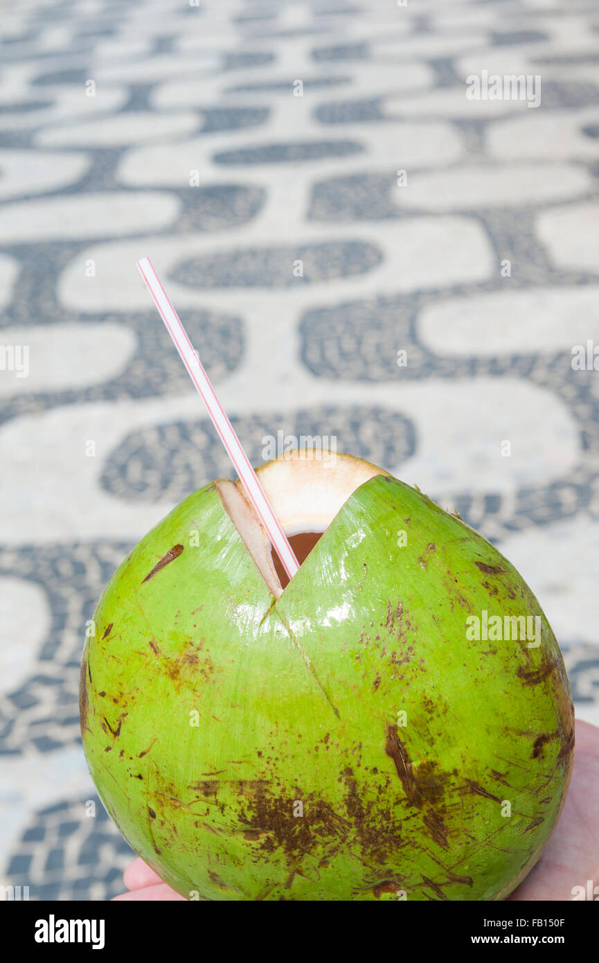 Fresh green Brazilian coco verde drinking coconut at Ipanema Beach ...