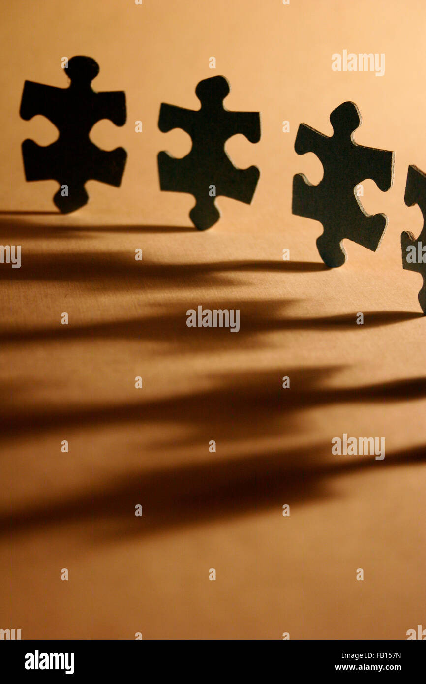 Puzzle pieces with shadows, people interpretation Stock Photo - Alamy