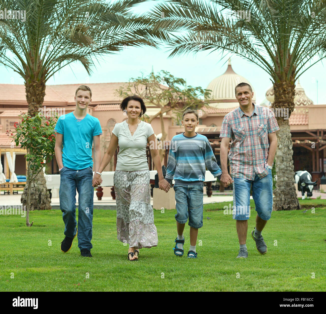 family in tropical ressort Stock Photo - Alamy