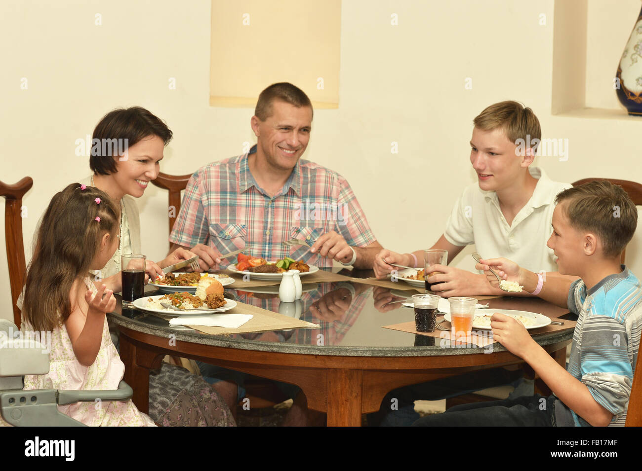Happy family at breakfast Stock Photo - Alamy