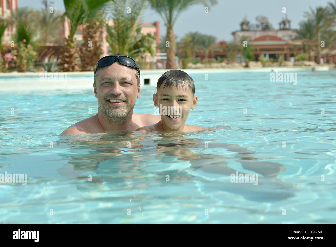 Father with son in pool Stock Photo - Alamy