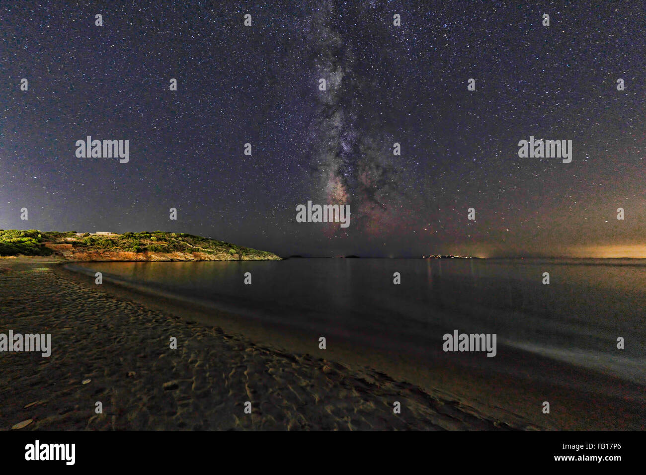Agios Petros beach at night under the Milky Way in Andros, Greece Stock ...