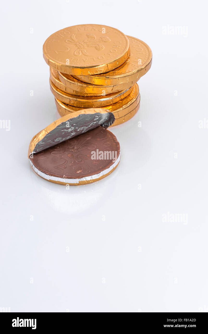 Stack of chocolate money covered in fake gold foil. Supposed to be UK ...