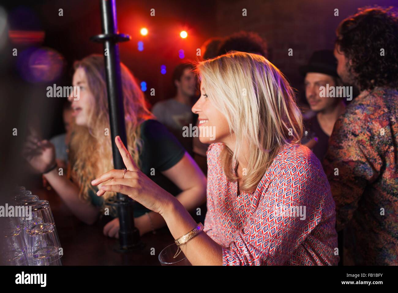 Group of friends celebrating in club Stock Photo - Alamy