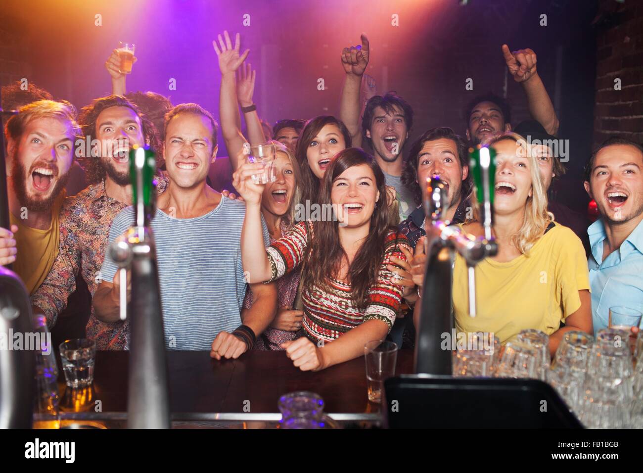 Group of friends celebrating in club Stock Photo - Alamy