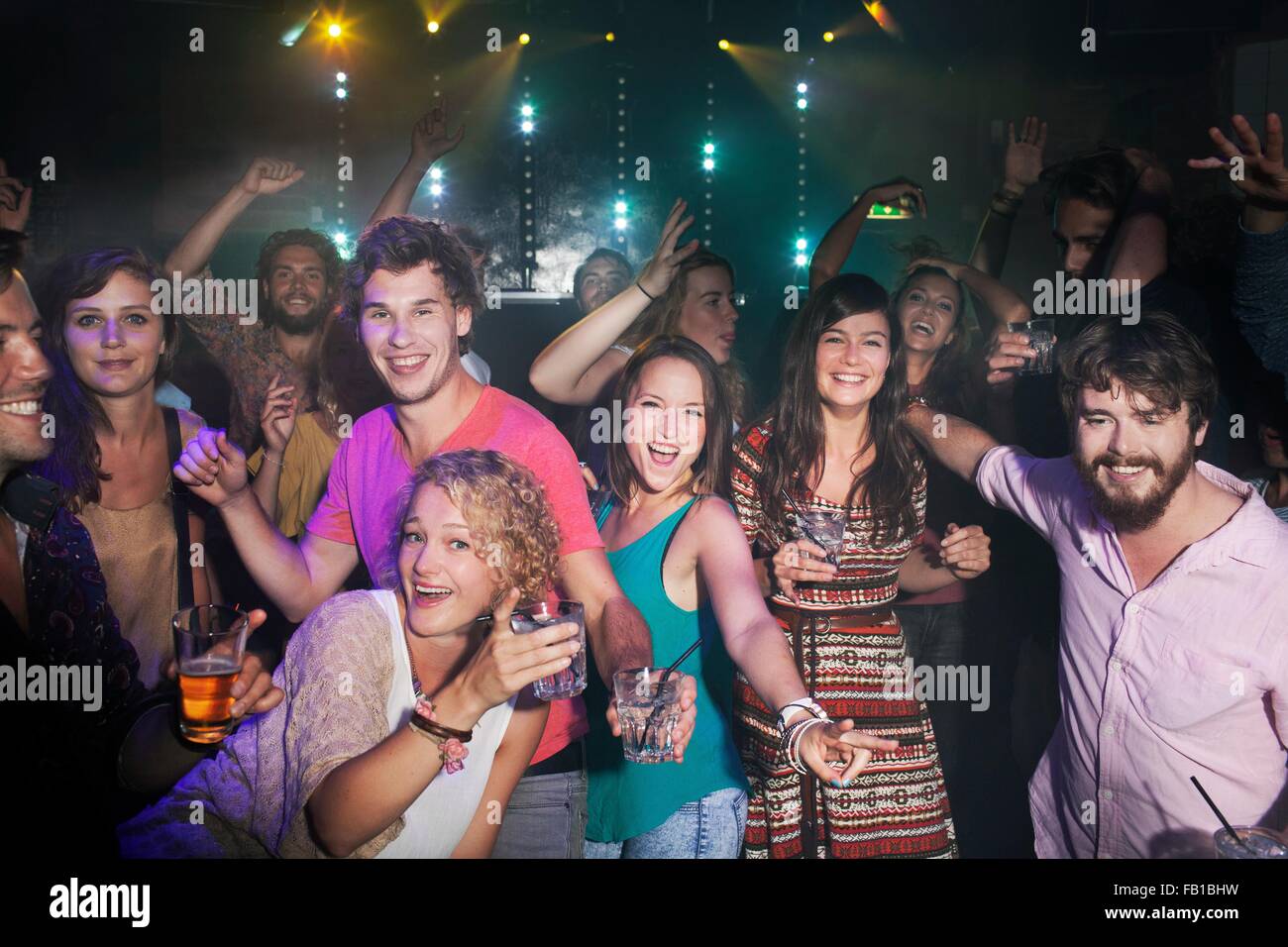 Group of friends celebrating in club Stock Photo - Alamy
