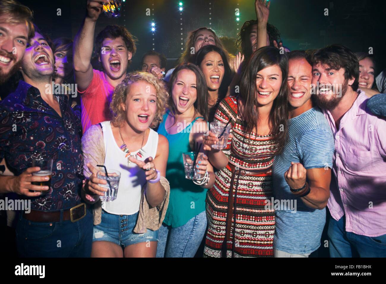 Group of friends celebrating in club Stock Photo - Alamy