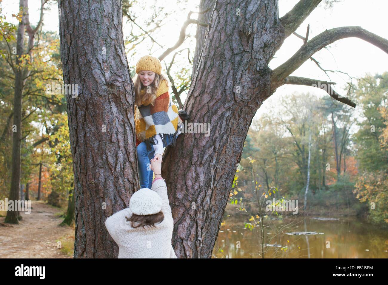 Girl climb tree hi-res stock photography and images - Alamy