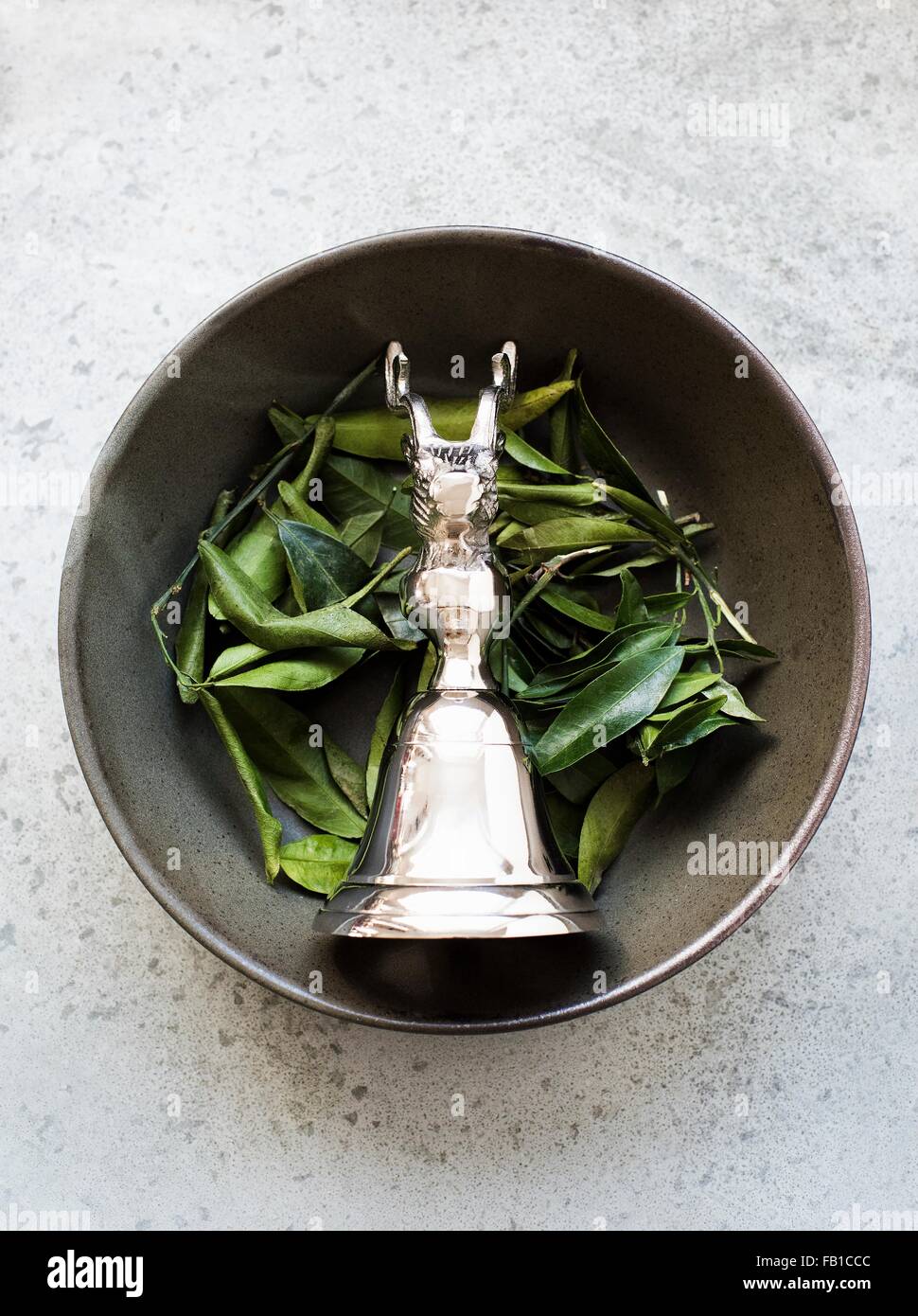 Overhead view of Christmas bell in bowl of herbs Stock Photo - Alamy