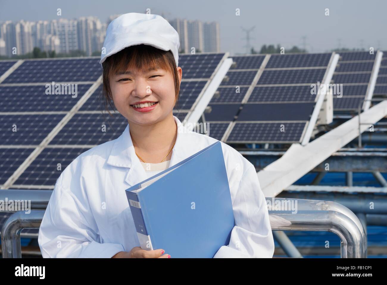 Female worker on roof of solar panel assembly factory, Solar Valley ...