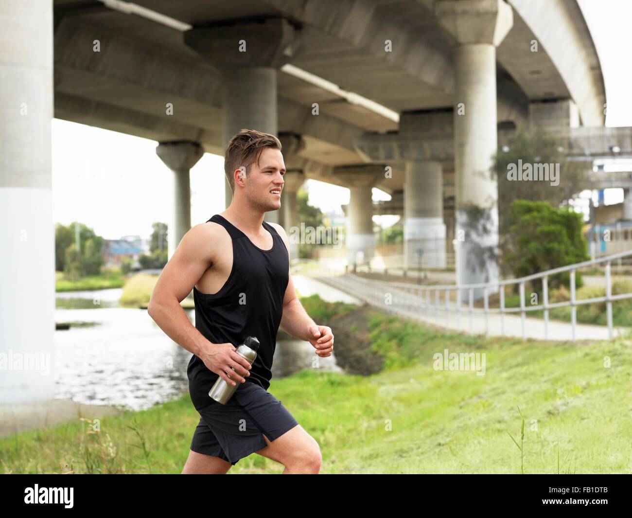 Young man running, outdoors Stock Photo - Alamy