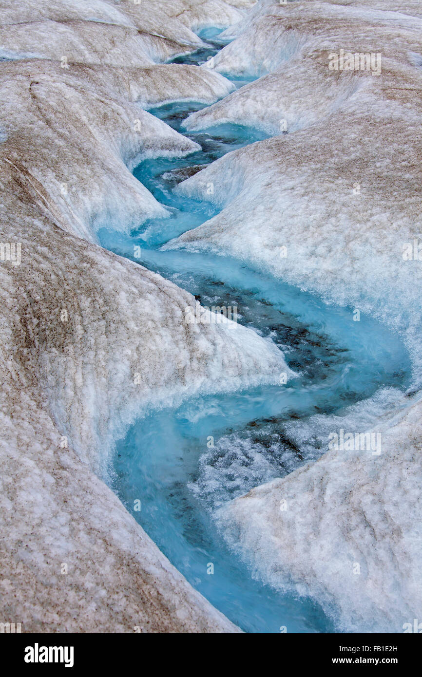 Supraglacial / surface meltwater flowing through sinuous channel on ...