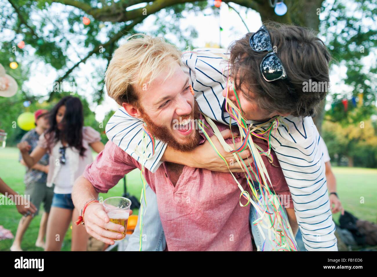 Two male friends hugging and laughing hi-res stock photography and ...
