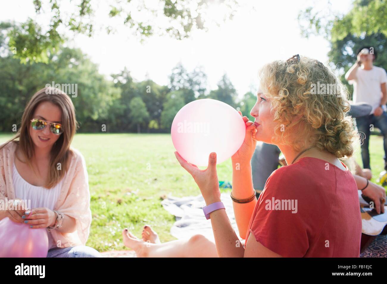 Blowing up balloon woman hi-res stock photography and images - Alamy