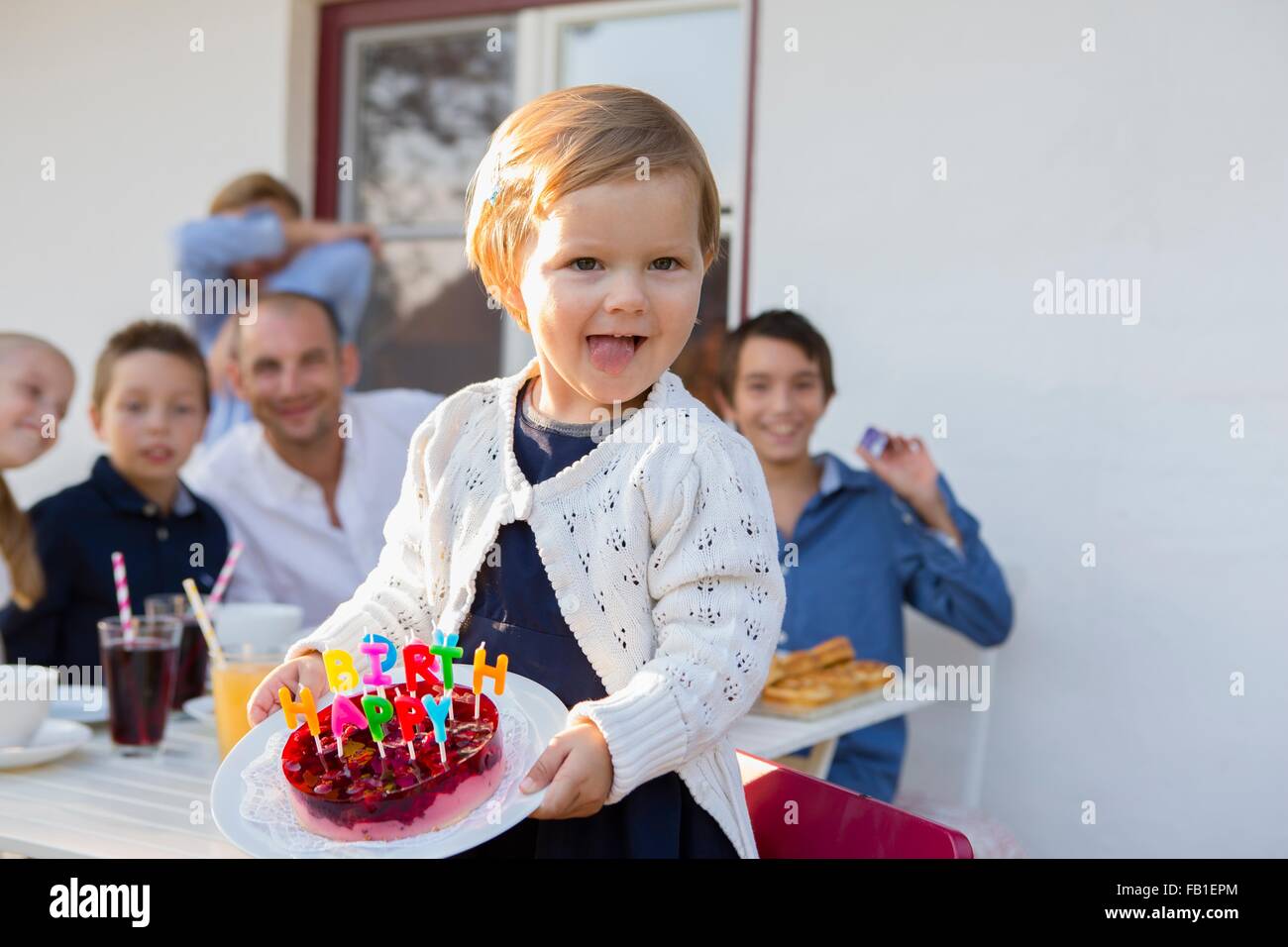 Boy carrying cake hi-res stock photography and images - Alamy