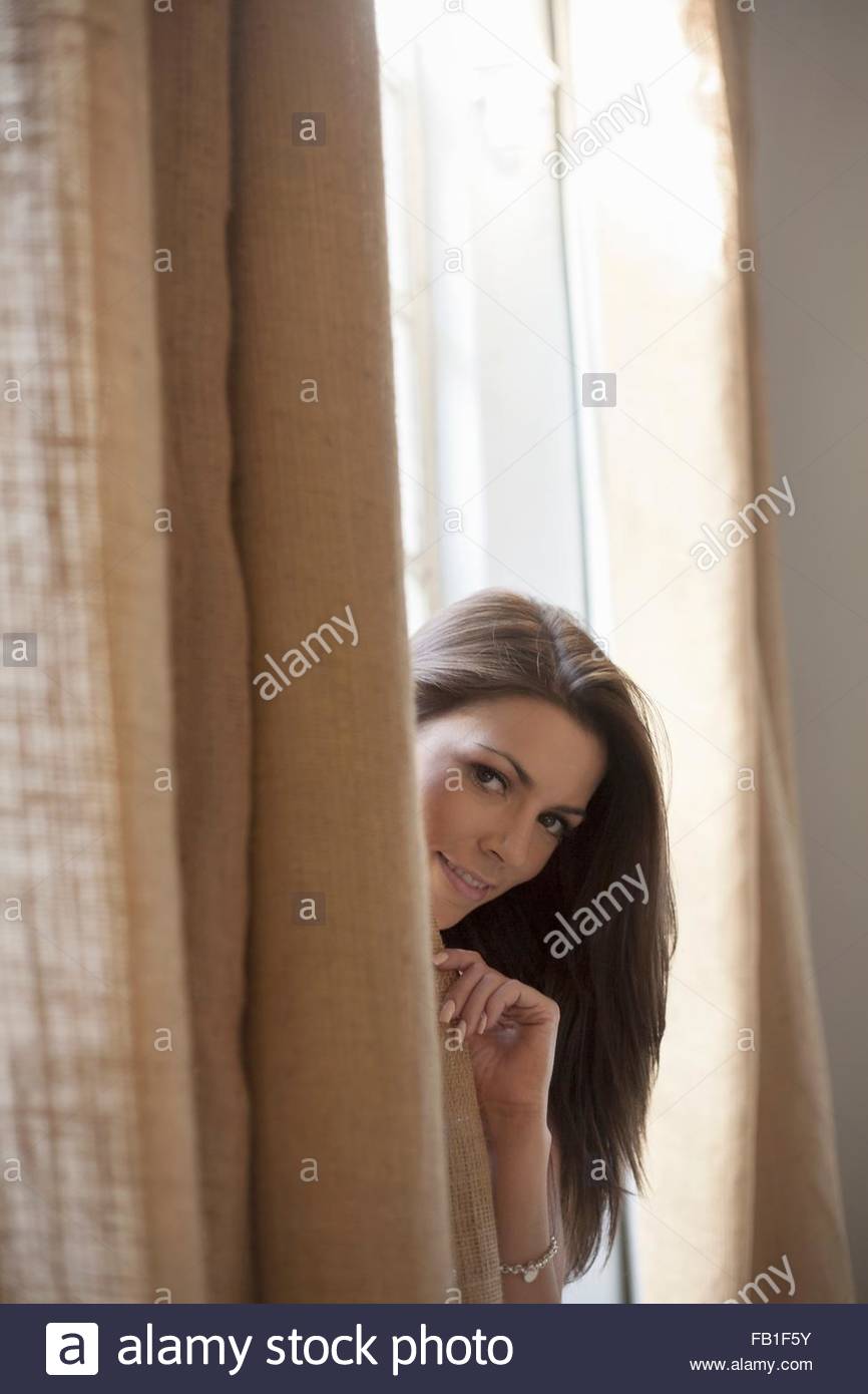 Woman Peering Curtain Stock Photos & Woman Peering Curtain Stock Images ...