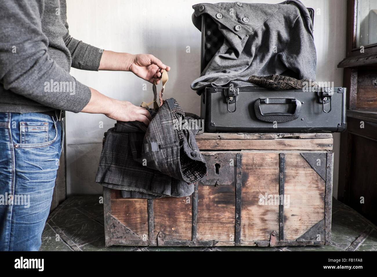 Photographer getting equipment ready, mid section Stock Photo - Alamy
