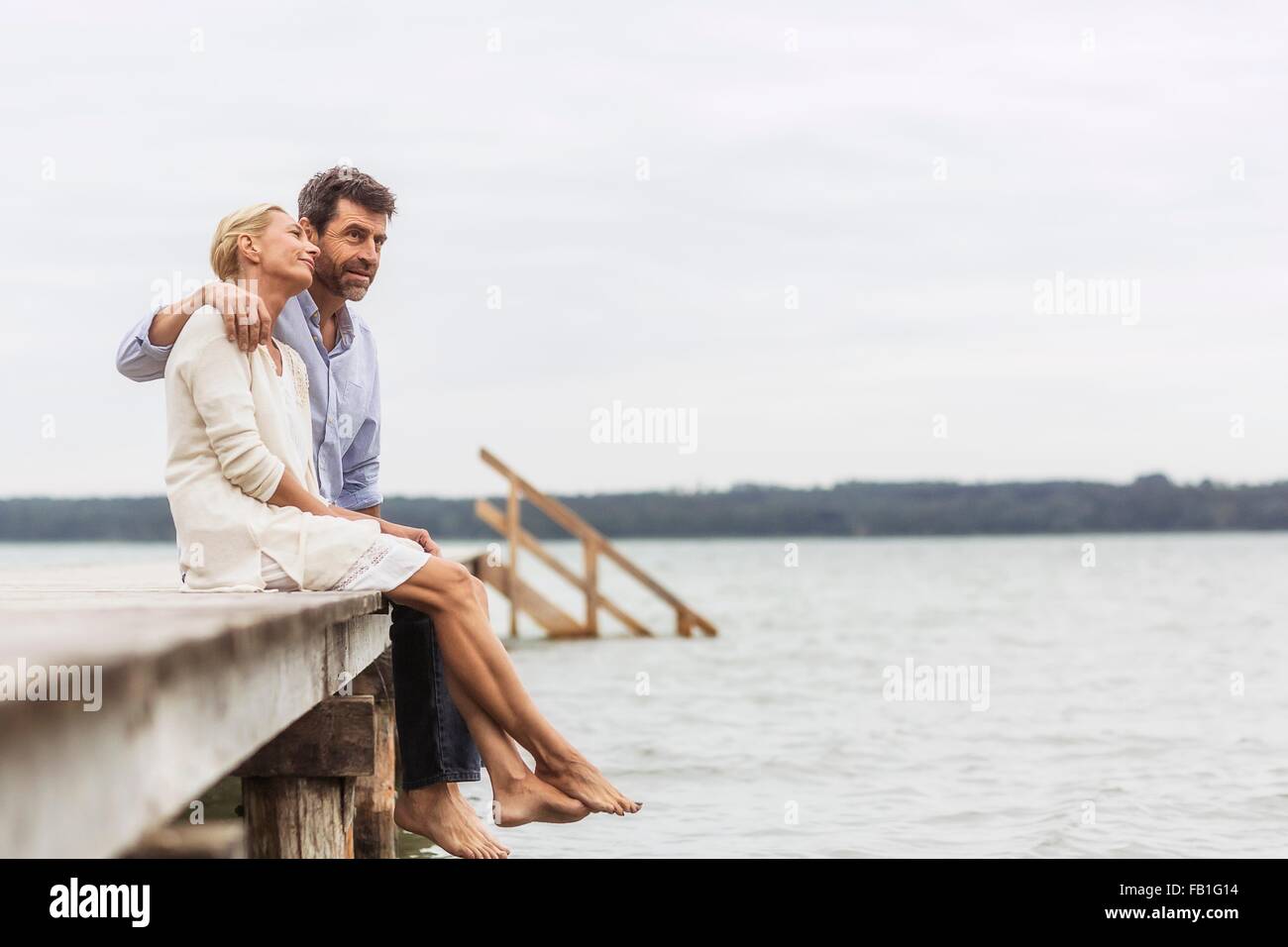 Man sitting on edge hi-res stock photography and images - Alamy