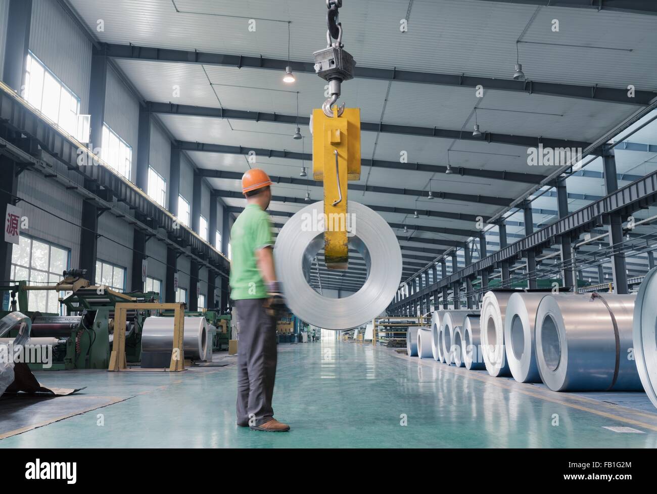 Worker in solar panel assembly factory, Solar Valley, Dezhou, China ...