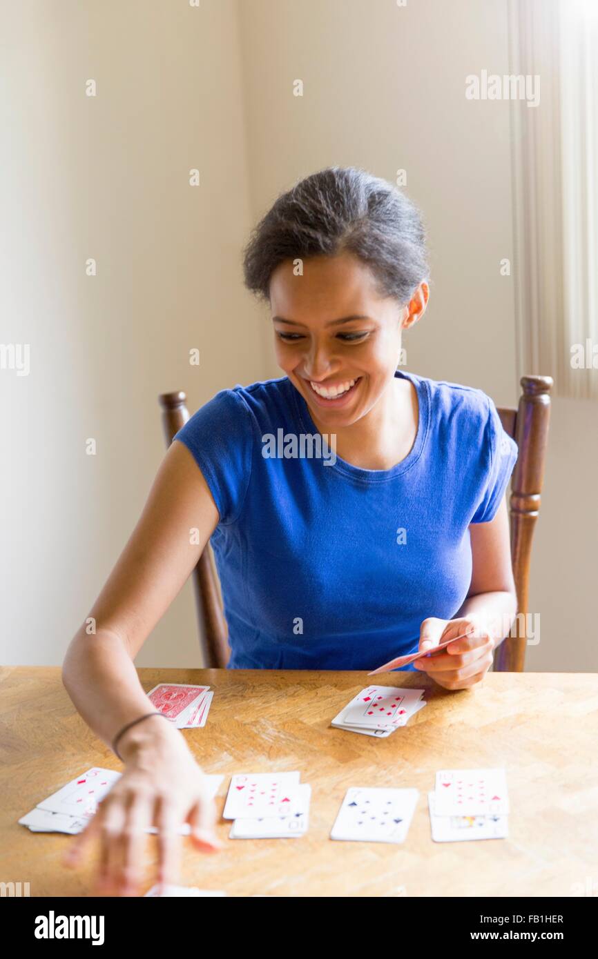 Young woman sitting dining table hi-res stock photography and images ...