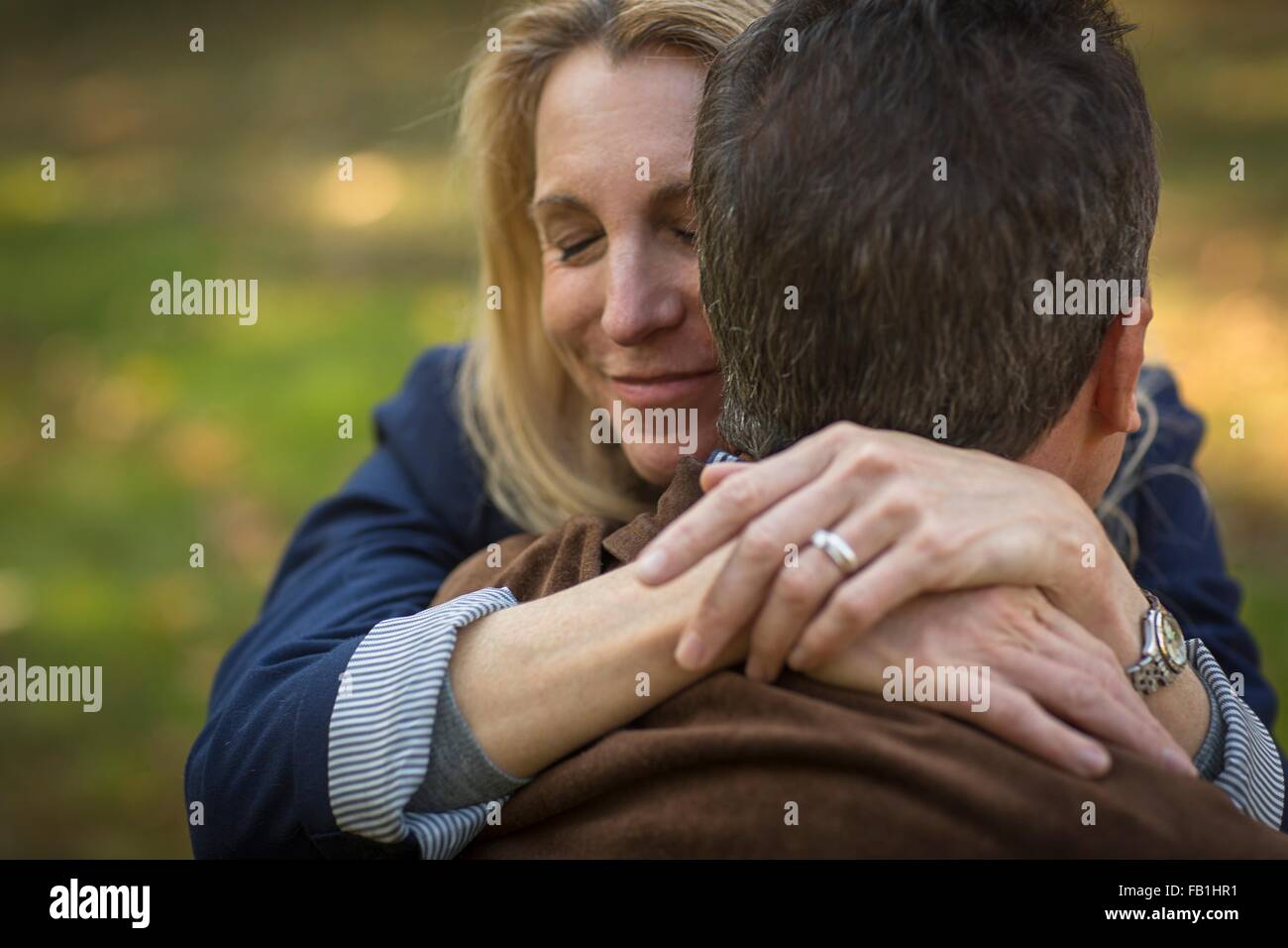 Close up of romantic mature couple hugging in garden Stock Photo - Alamy