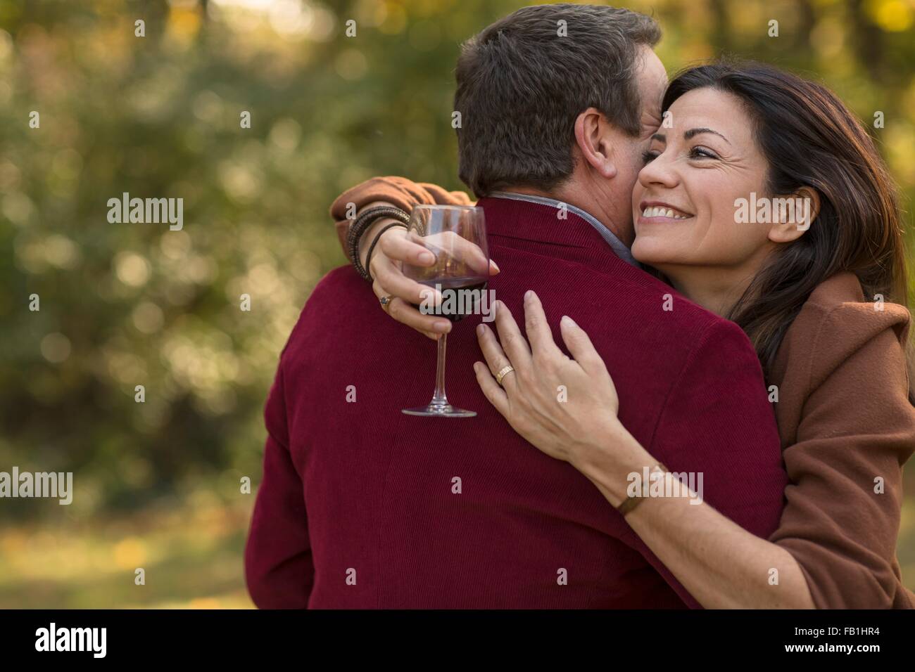 Close up of mature couple hugging in garden Stock Photo - Alamy