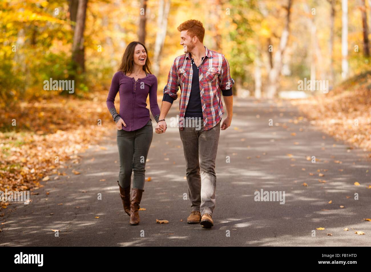 Young couple strolling autumn park hi-res stock photography and images ...