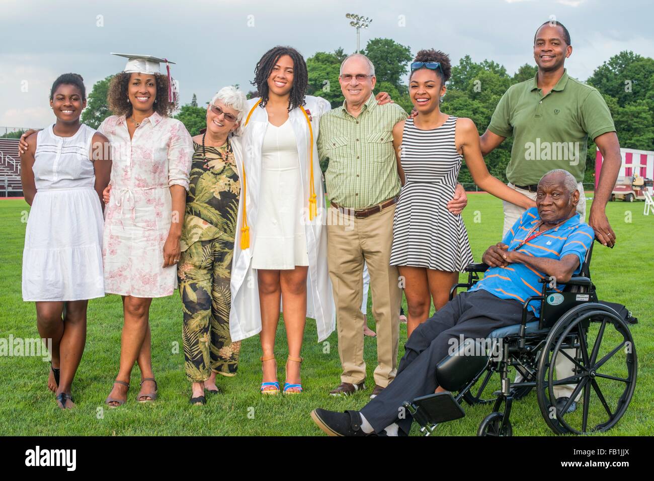 Teenage girl with parents and grandparents at graduation ceremony Stock ...