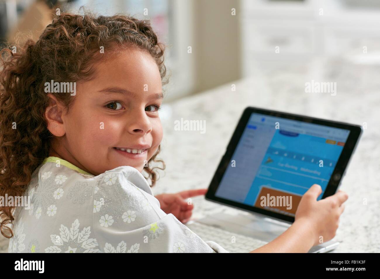 Child over shoulder tablet hi-res stock photography and images - Alamy
