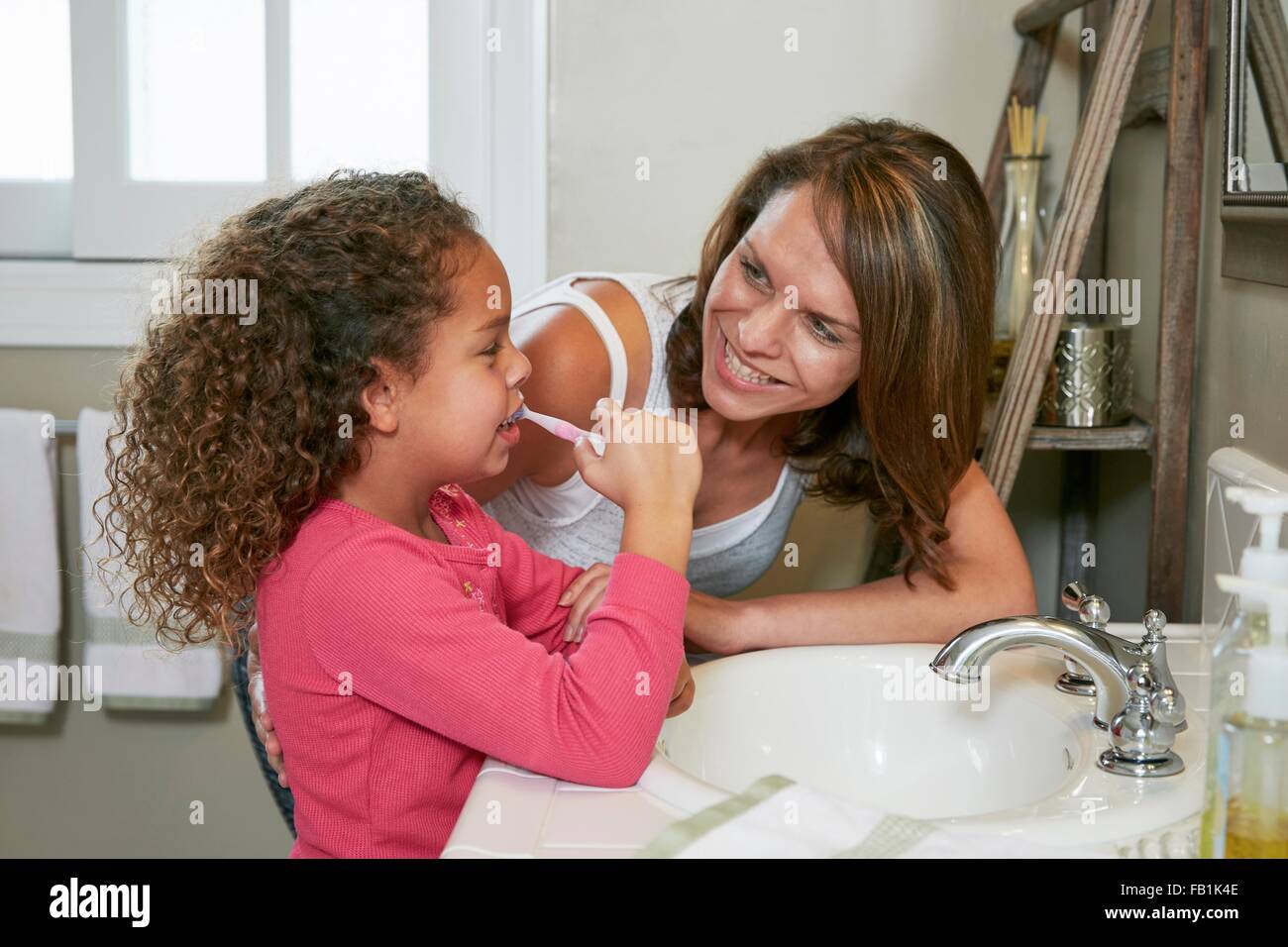 Child Brushing Teeth At Sink