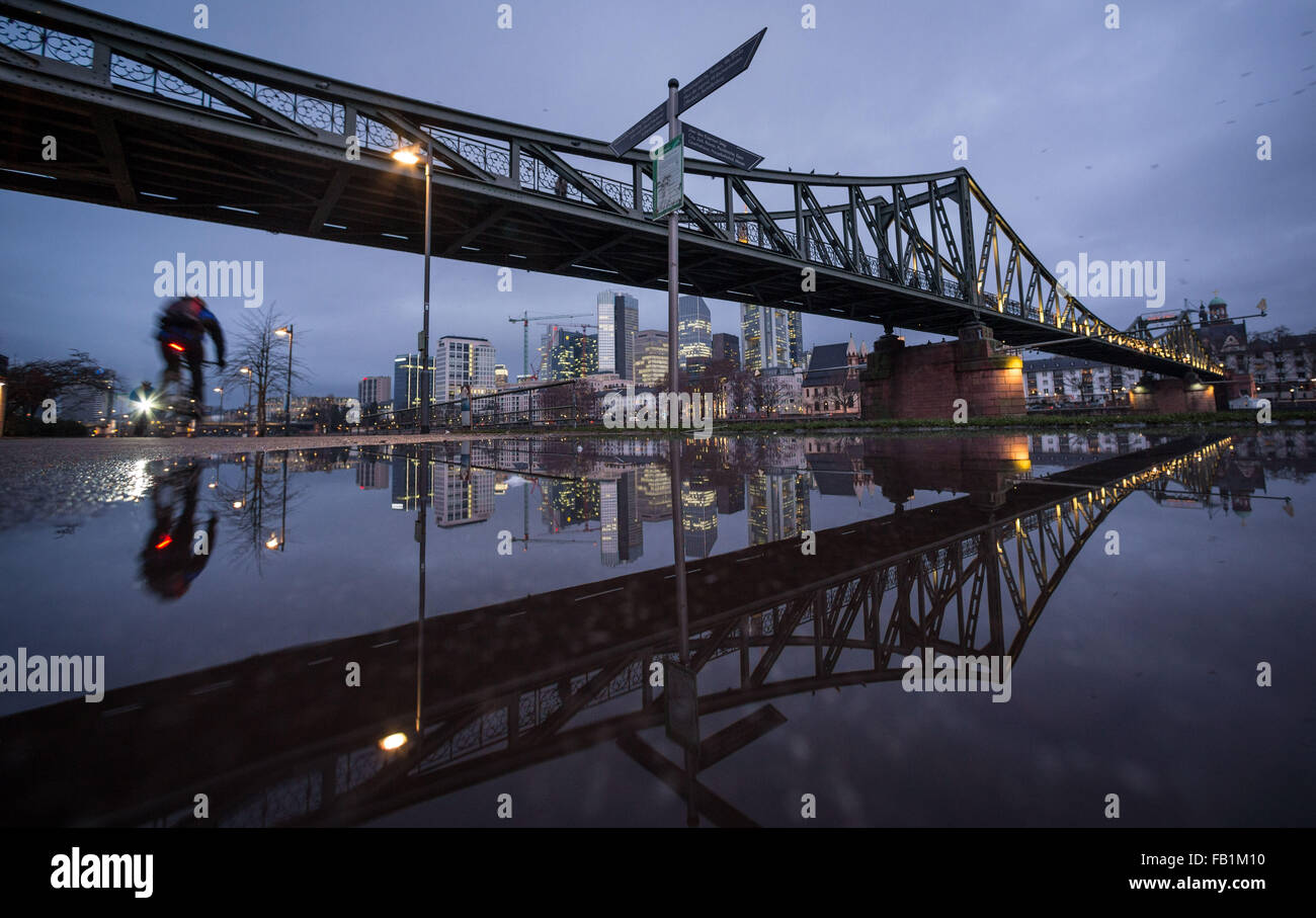 The Eiserner Steg bridge mirrors on the surface of the river Main in ...