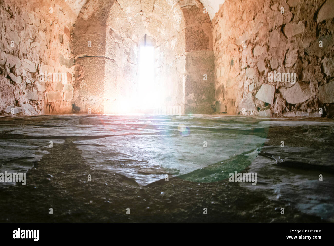Ray of light entering by defensive loophole at Olivenza castle, built ...