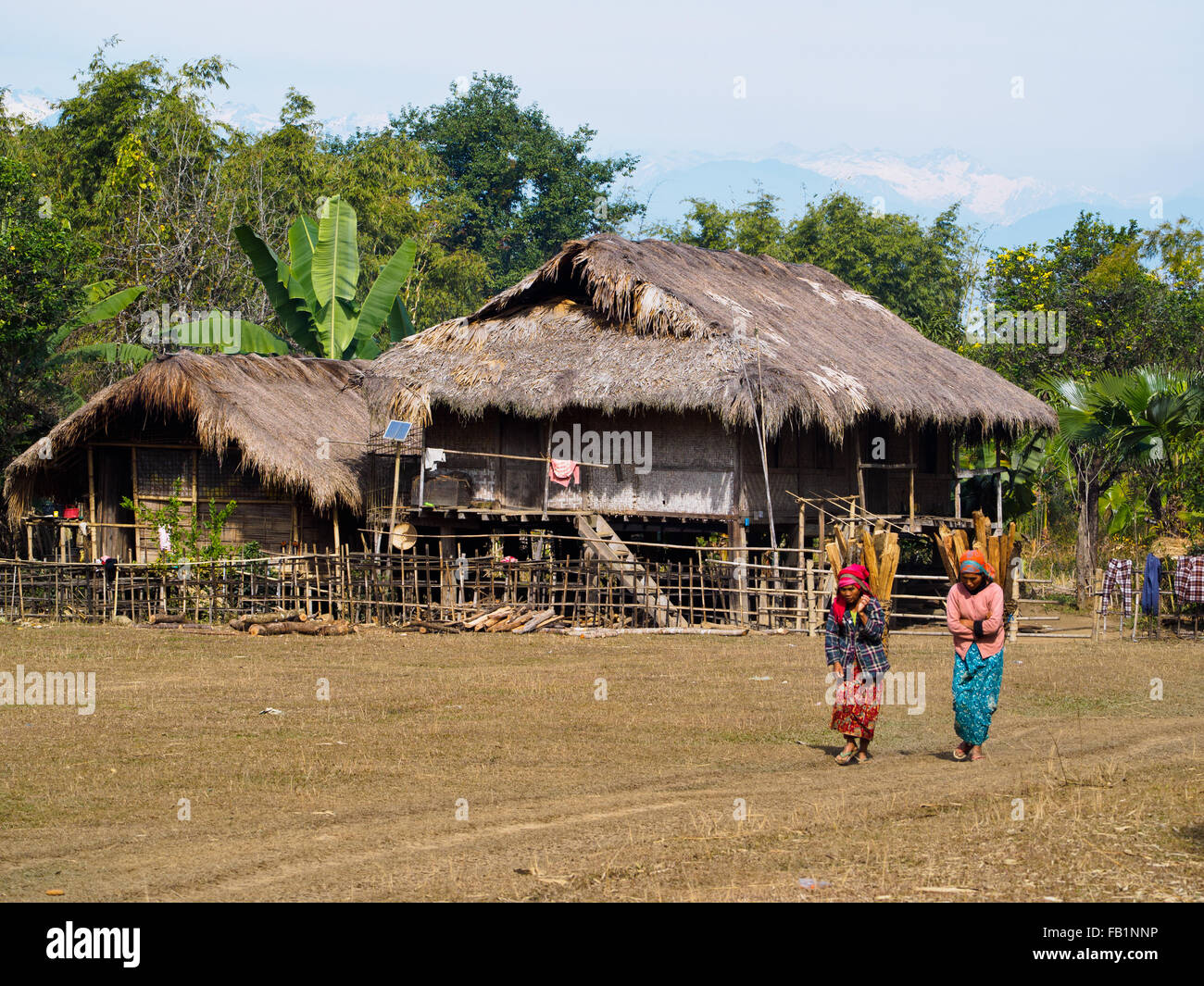 A house in Putao with the mighty snow-capped mountains at the back ...