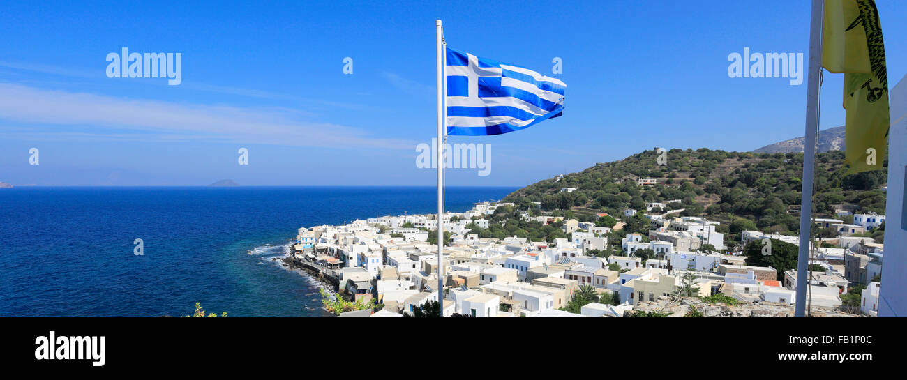 Summer, Greek flag over Mandraki town, the capital of Nisyros volcanic ...