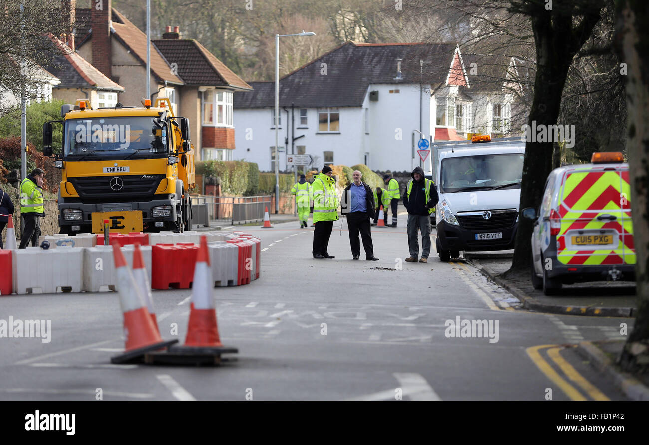 Neath, UK. Thursday 07 January 2016 Council officials by the sinkhole ...