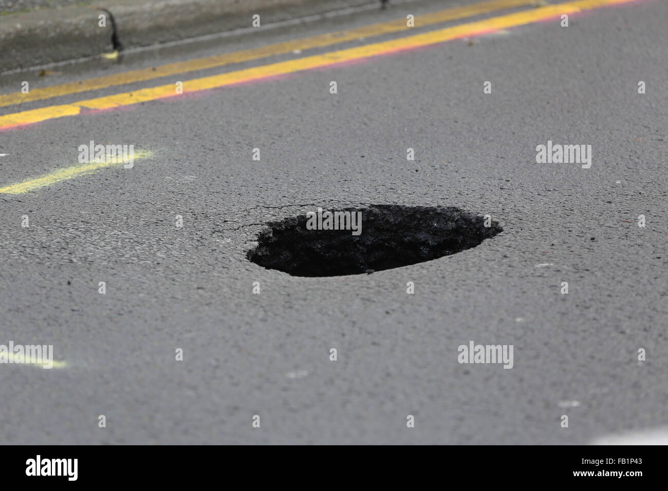 Neath, UK. Thursday 07 January 2016 The sinkhole in Cimla Road, Neath ...