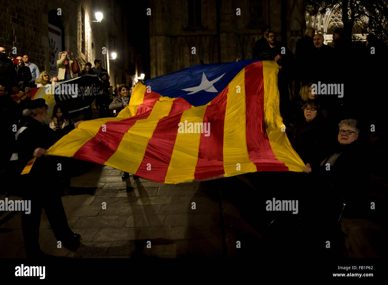 Barcelona, Spain. 7th January, 2016. People wave a giant estelada flag ...