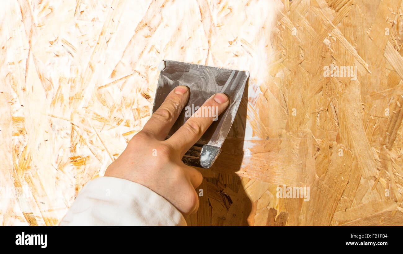 Hand with a spatula Stock Photo - Alamy